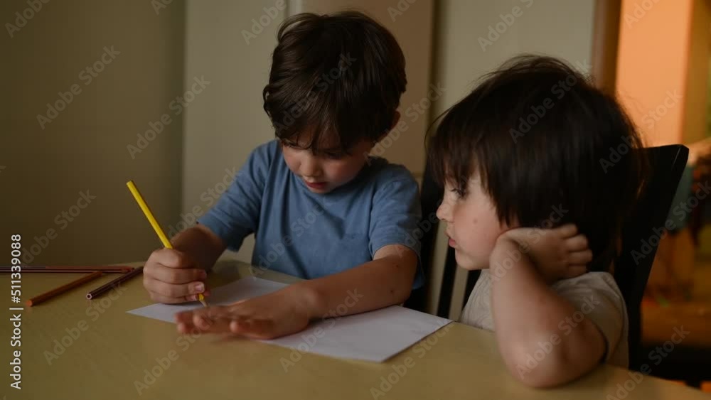 Video „two boys draw a drawing, the older brother shows the younger one ...