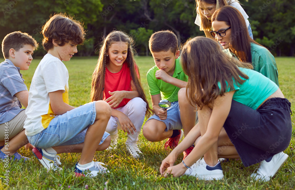 Children having outdoor biology class. Kids learning to take care of ...