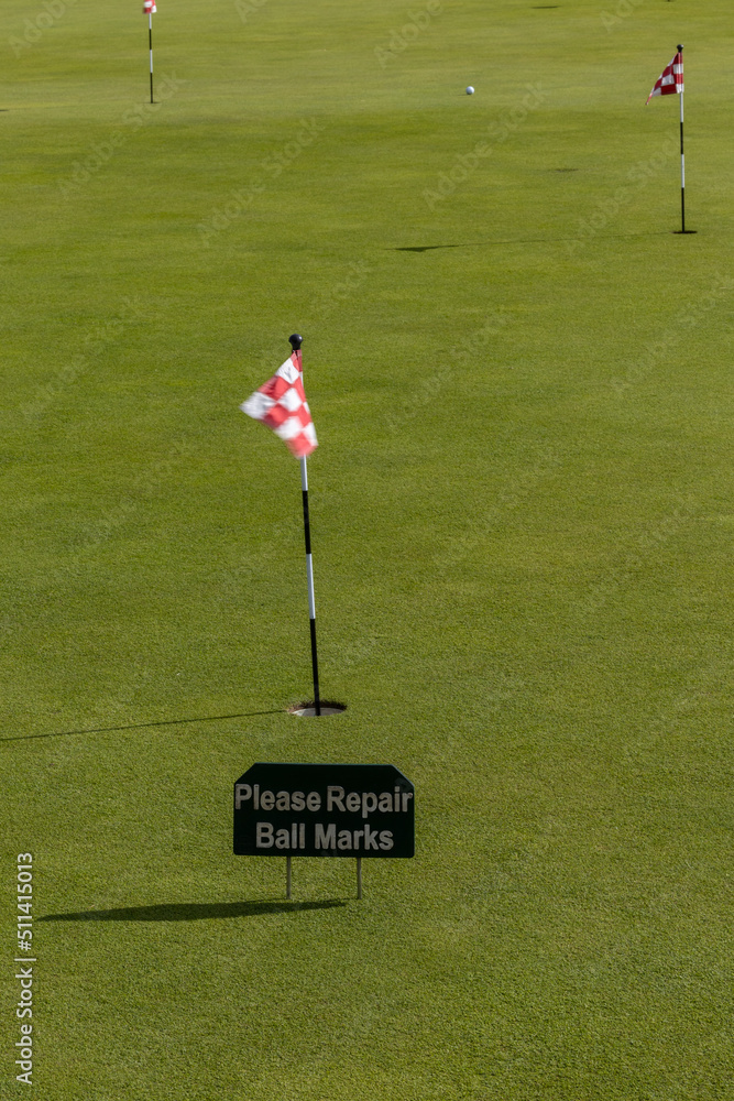 Stockholm, Sweden A putting green at a golfcourse and a sign saying ...
