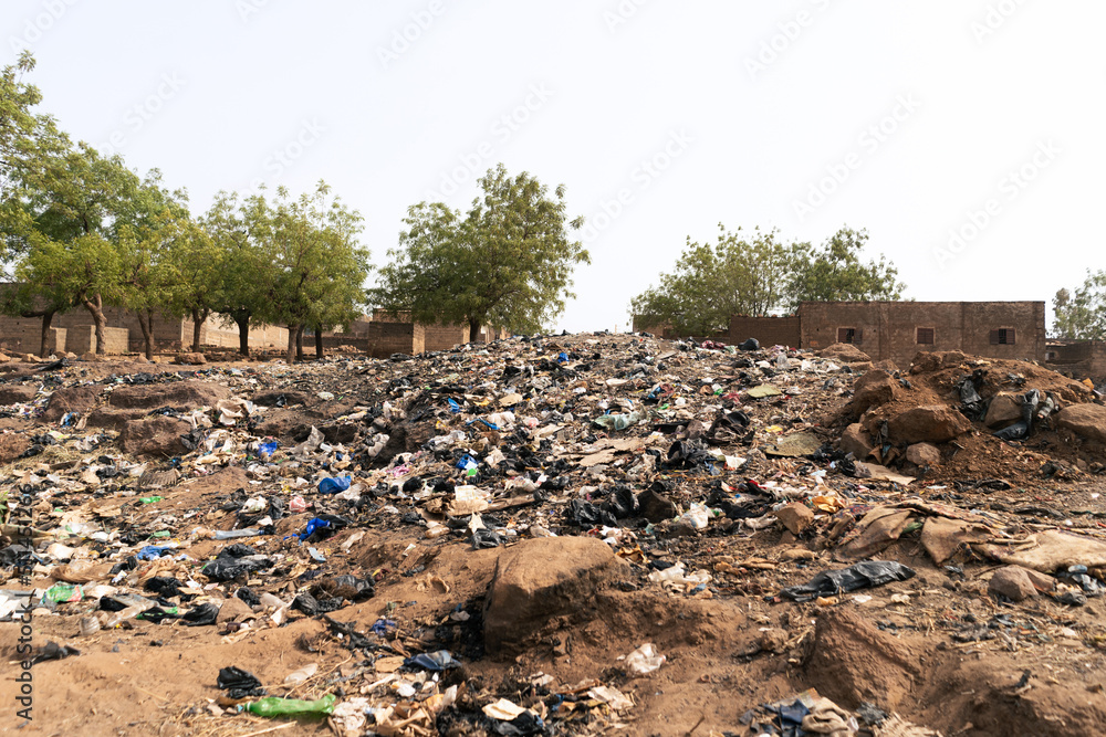 Scattered plastic trash litter and other garbage in an African urban ...