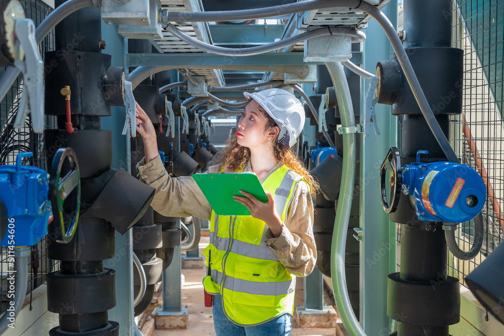 Engineer under checking the industry chilled water fan coil unit air ...