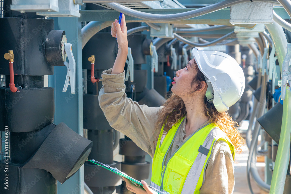 Engineer under checking the industry chilled water fan coil unit air ...