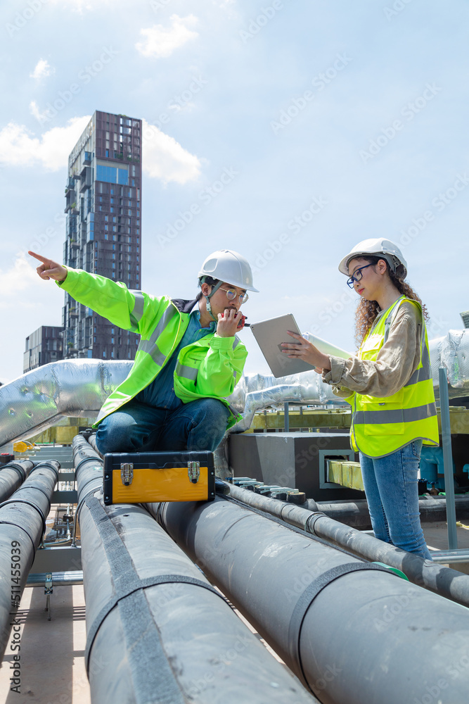 Engineer under checking the industry chilled water fan coil unit air ...
