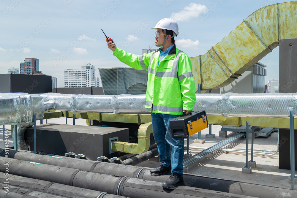 Engineer under checking the industry chilled water fan coil unit air ...