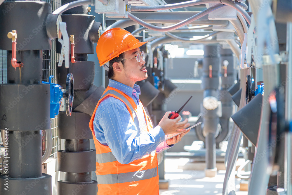 Engineer under checking the industry chilled water fan coil unit air ...
