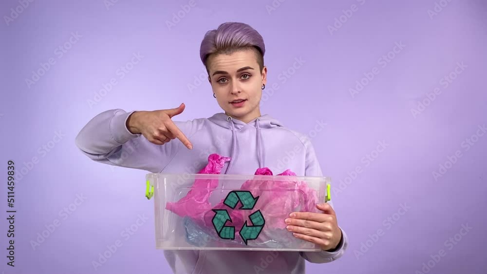 Confident ecofriendly person gen Z with short hair holding container ...