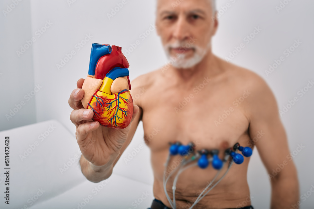 Heart health concept, cardiac tests, cardiogram. Senior man during ...