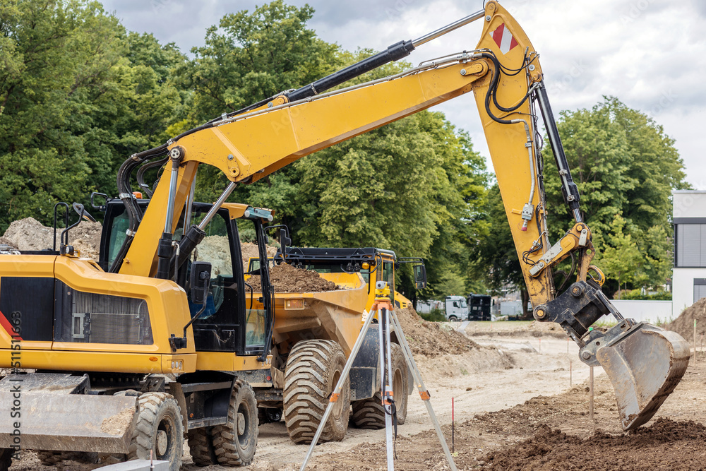Excavator work on construction site. Earthworks for sidewalk. Leveling ...