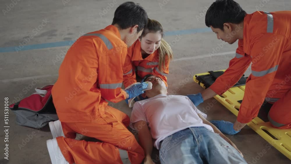 Female medical used her hands to support the accident victim's head and ...