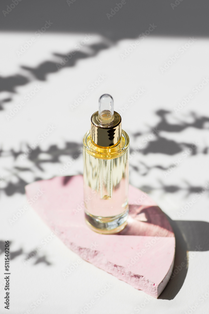Transparent bottle with dropper pipette with serum or essential oil on ...