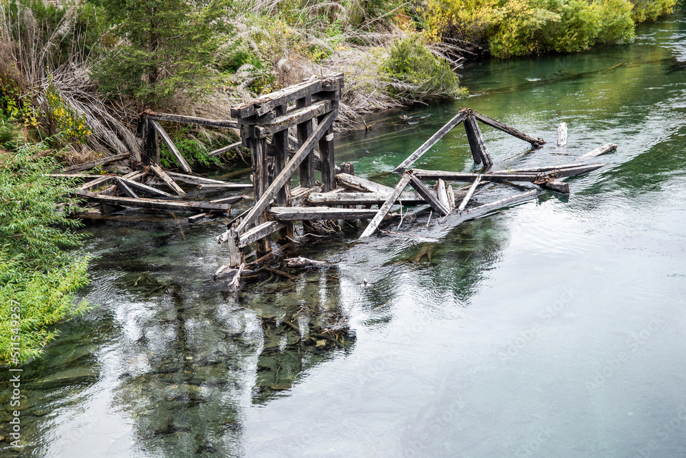 View of the remains of the old wooden bridge that crossed the Ruca ...