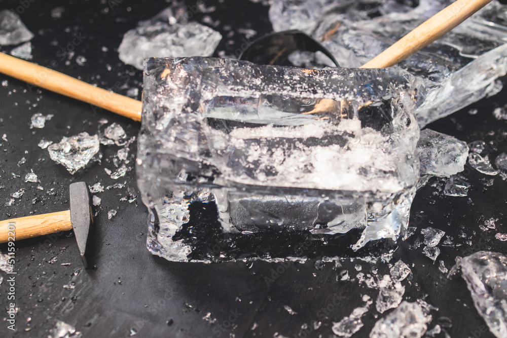 Process of breaking the ice with hammer and ice pick, group of people ...
