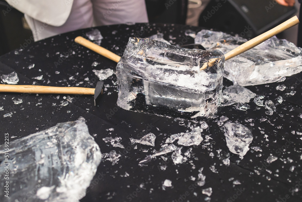 Process of breaking the ice with hammer and ice pick, group of people ...