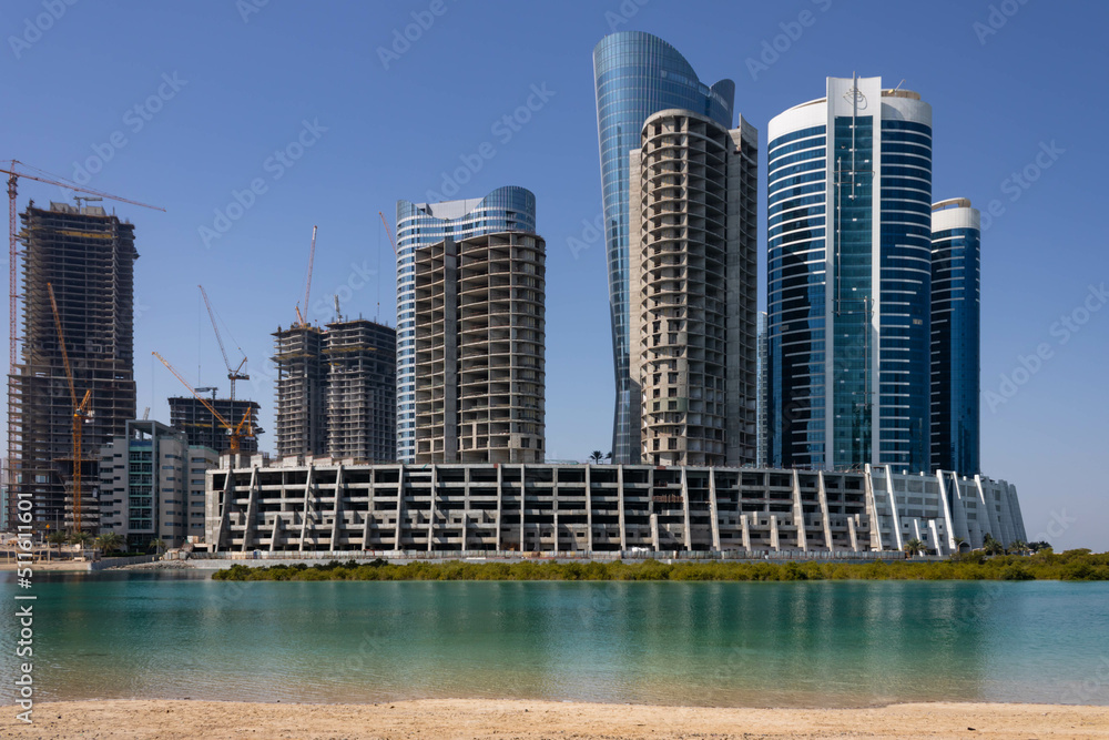 Modern high-rise residential and office buildings under construction on ...