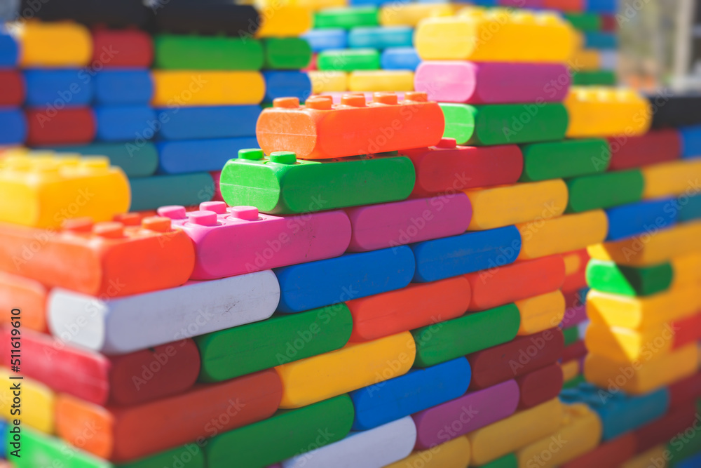 Children play colorful big toy blocks in kindergarten day care center ...