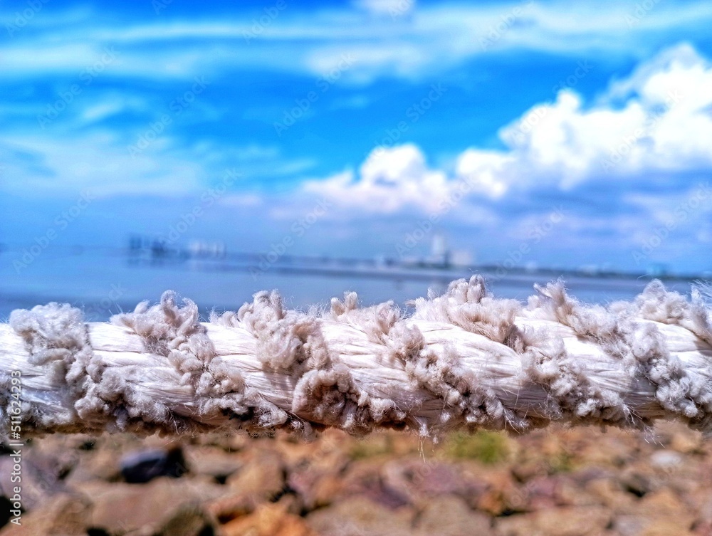 Rope with beautiful background beach. Behind the rope is a beach also ...