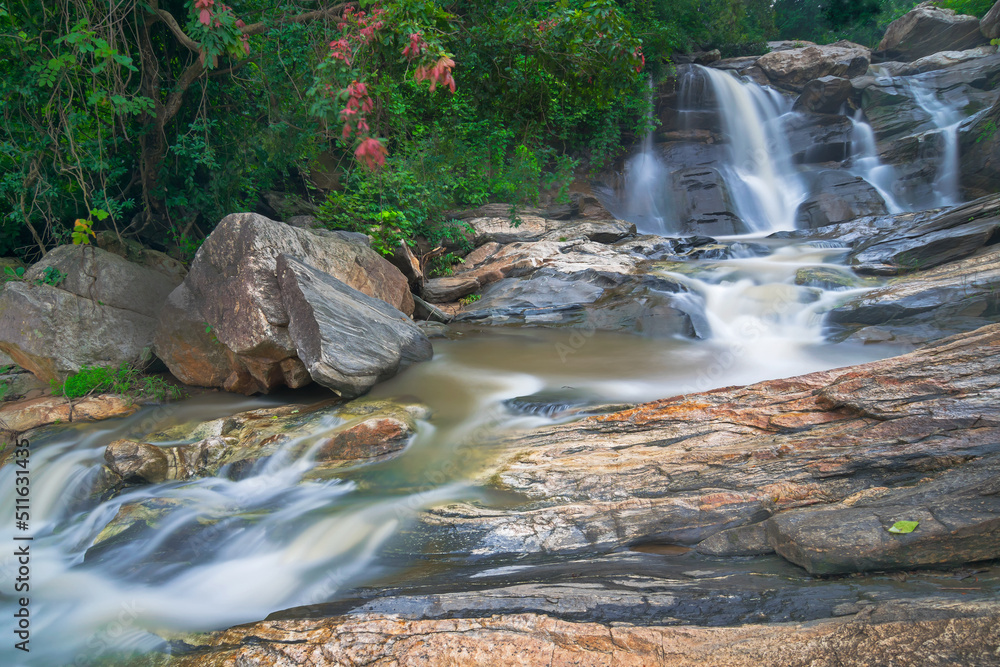 Beautiful Turga waterfall having full streams of water flowing downhill ...