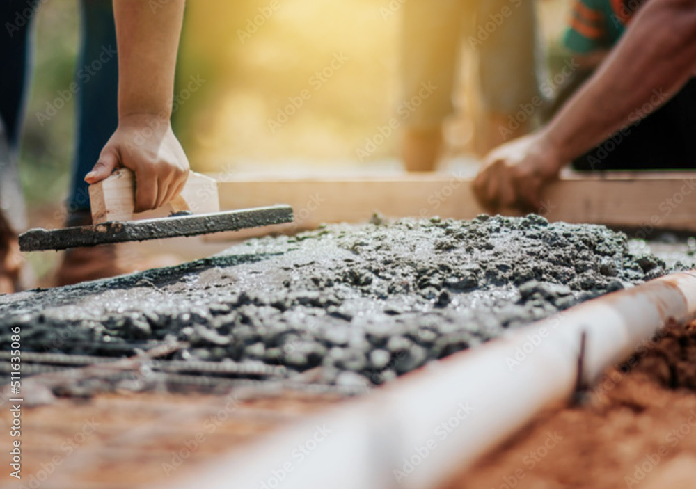 construction concept Using tools to level the mortar in the ...