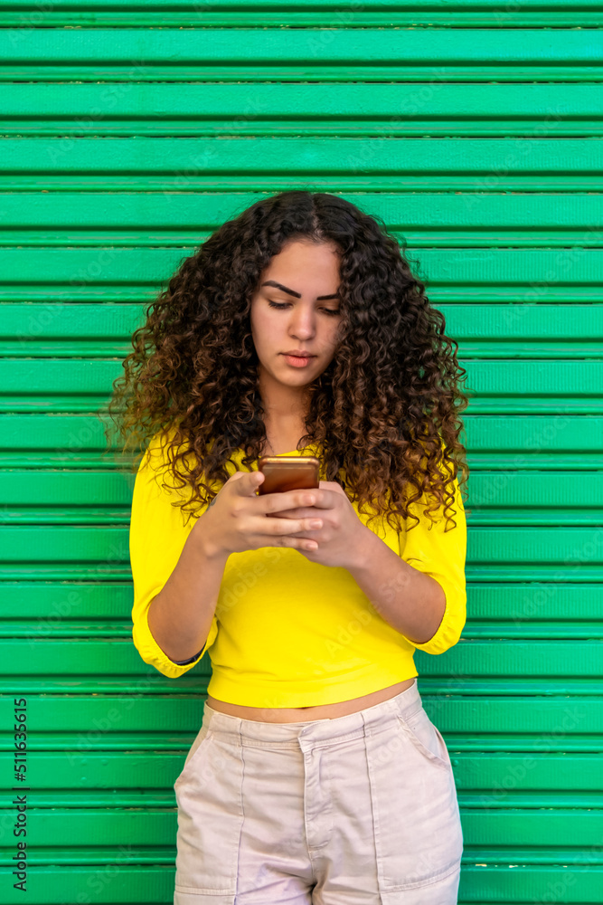 Portrait Of Pretty Brazilian Girl Using Smartphone Elegant Latin Woman From Brazil With Curly