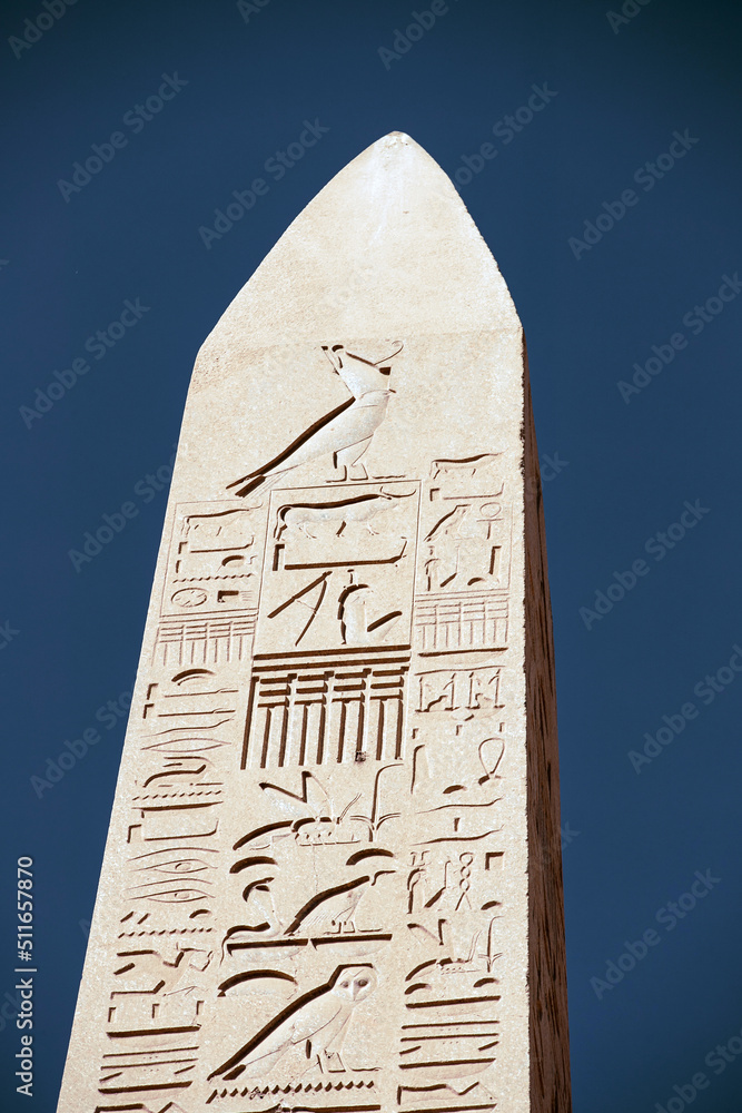Real ancient Egyptian hieroglyphics engraved in a stone obelisk at Karnak Temple in Luxor Egypt ...