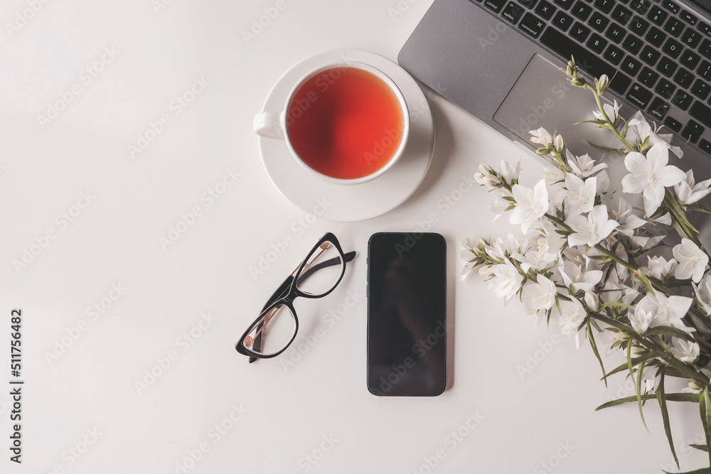 Workplace top view, laptop, cup of tea, phone, glasses Stock Photo ...