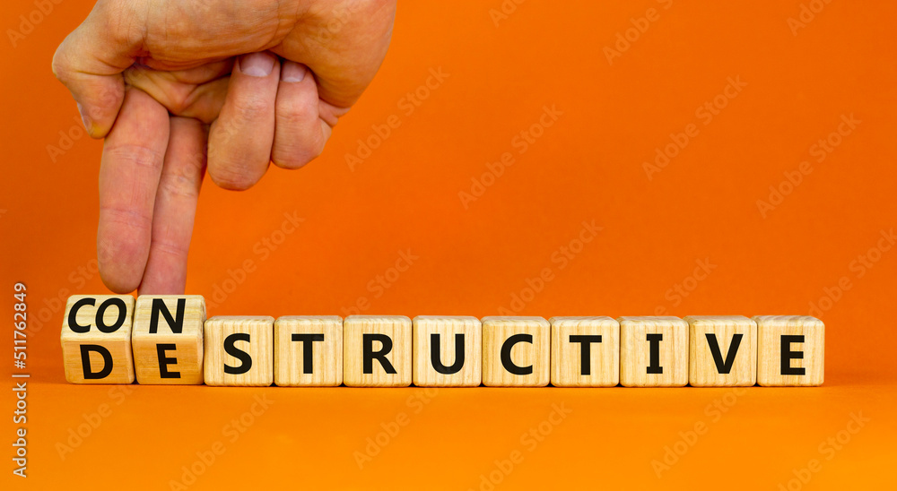 Destructive or constructive symbol. Businessman turns cubes changes the ...