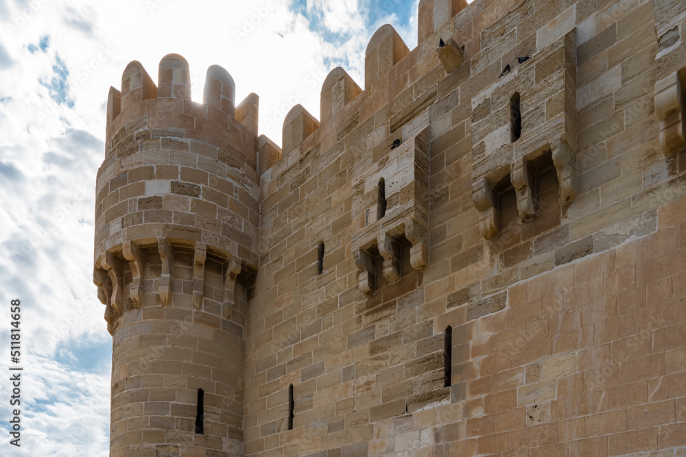 A fragment of the ancient Citadel of Qaitbay on the background of the ...