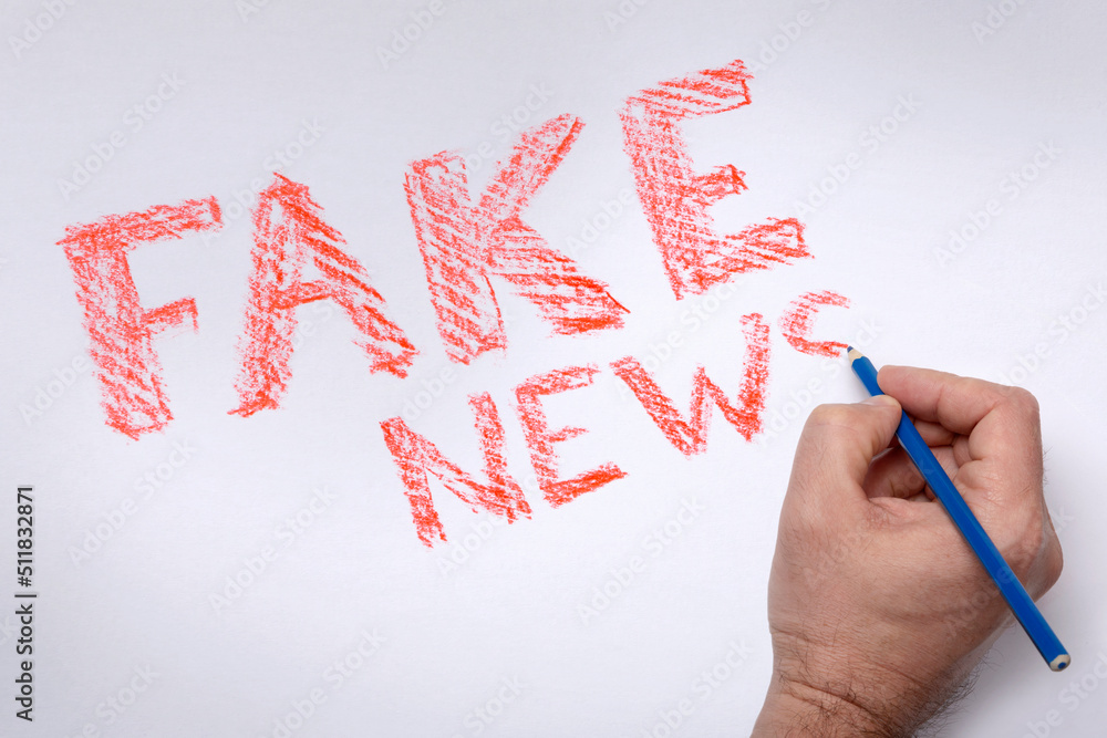 Lettering FAKE NEWS. Inscription FAKE NEWS is red, drawn with a blue ...