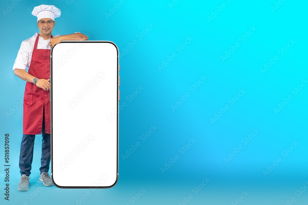 Phone with white screen. Chef man with phone. Restoraunt mobile offer on turquoise. Mock up ...