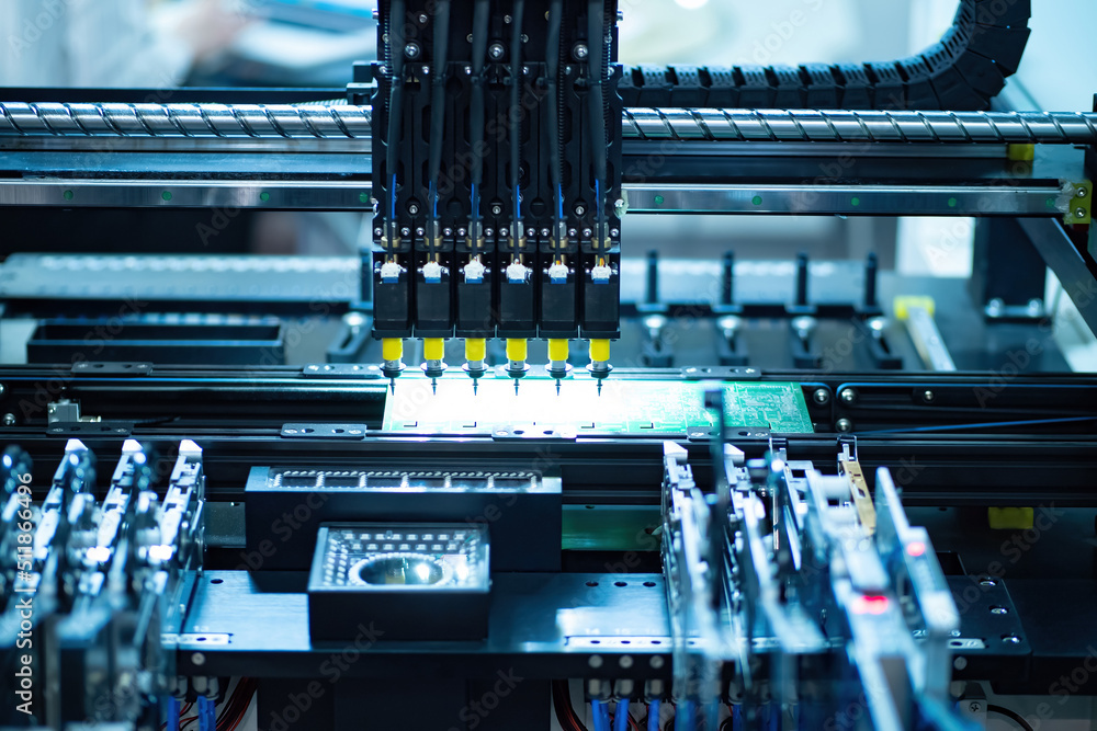 PCB production. Shot of Factory Machine at Work: Printed Circuit Board ...