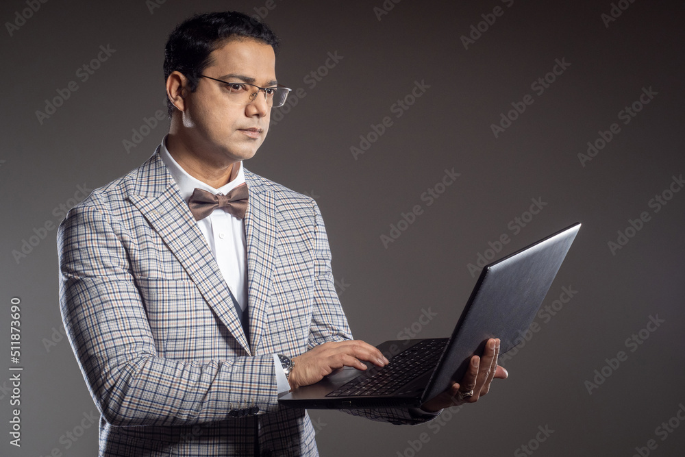 Man programmer. Programmer in suit. Man with laptop in his hands ...