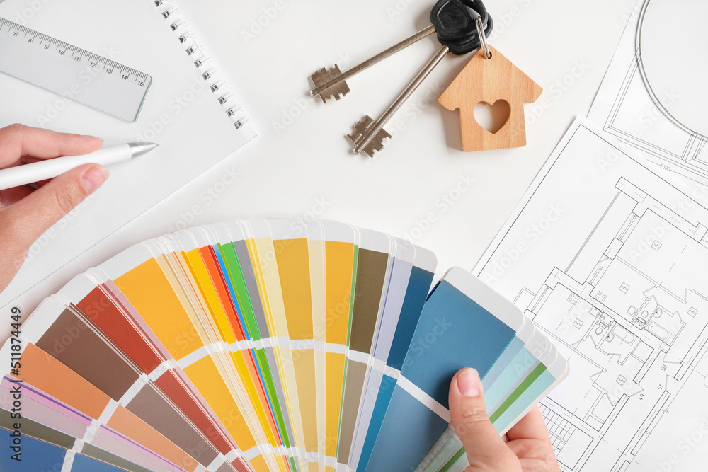 Hands choosing Colors of Interior Design from the Color Guide ...