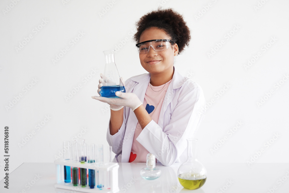 Smiling African black girl student is study and test for chemical and ...