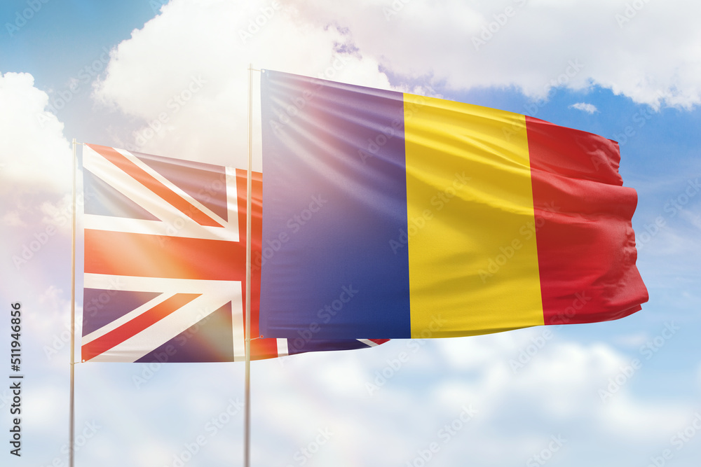 Sunny blue sky and flags of romania and united kingdom Stock Photo | Adobe Stock