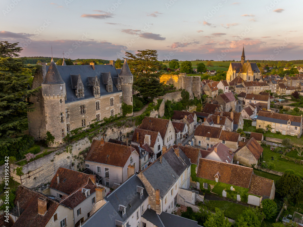 Aerial sunset view of Montresor medieval castle with a Renaissance mansion in Indre et Loire, on ...