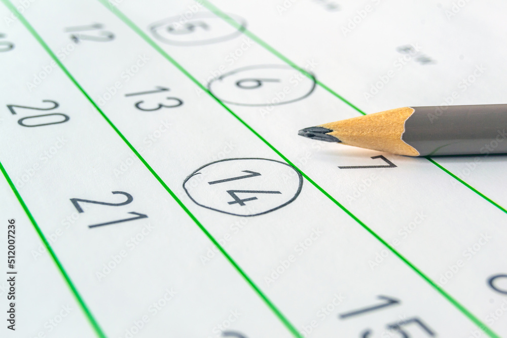 perspective view of a calendar sheet with marked dates. planning a ...