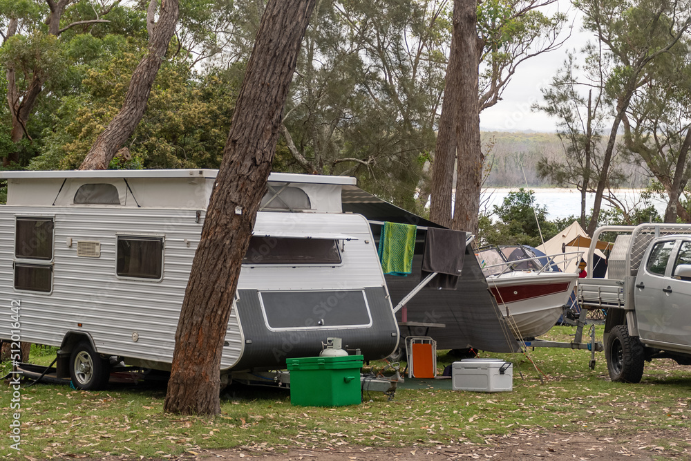 RV caravan camper on a campsite at holiday caravan park surrounding by ...