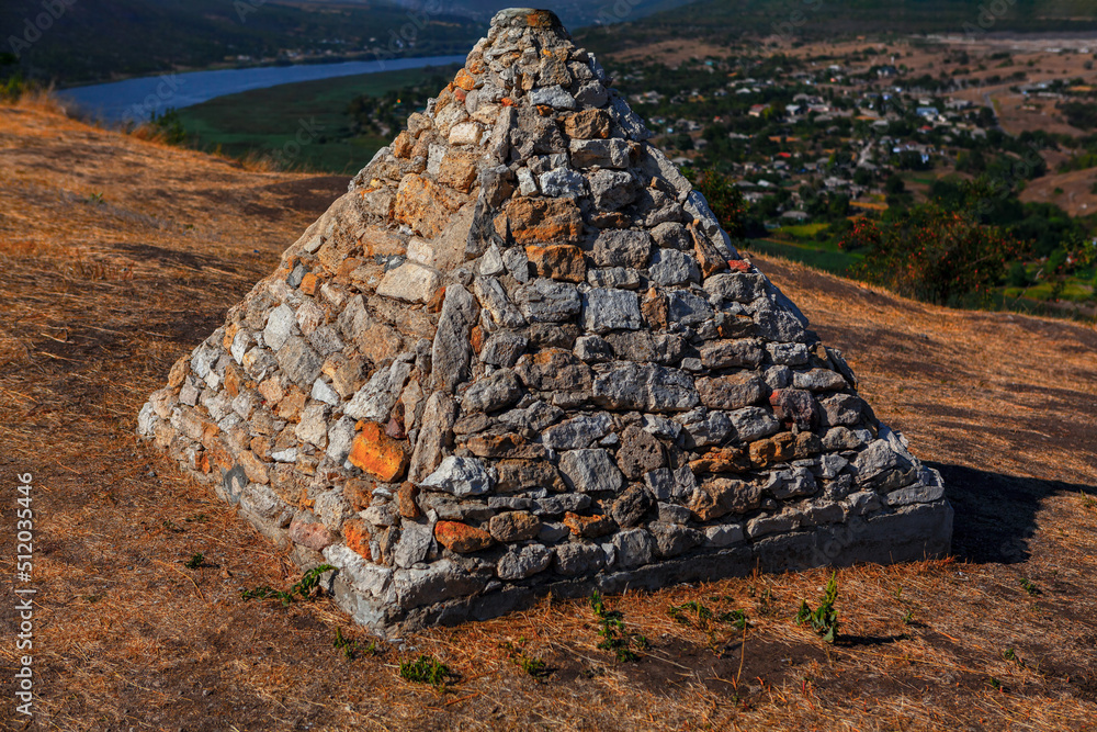 Stone pyramid . Pile of stones form a pyramid . Ancient symbol monument ...