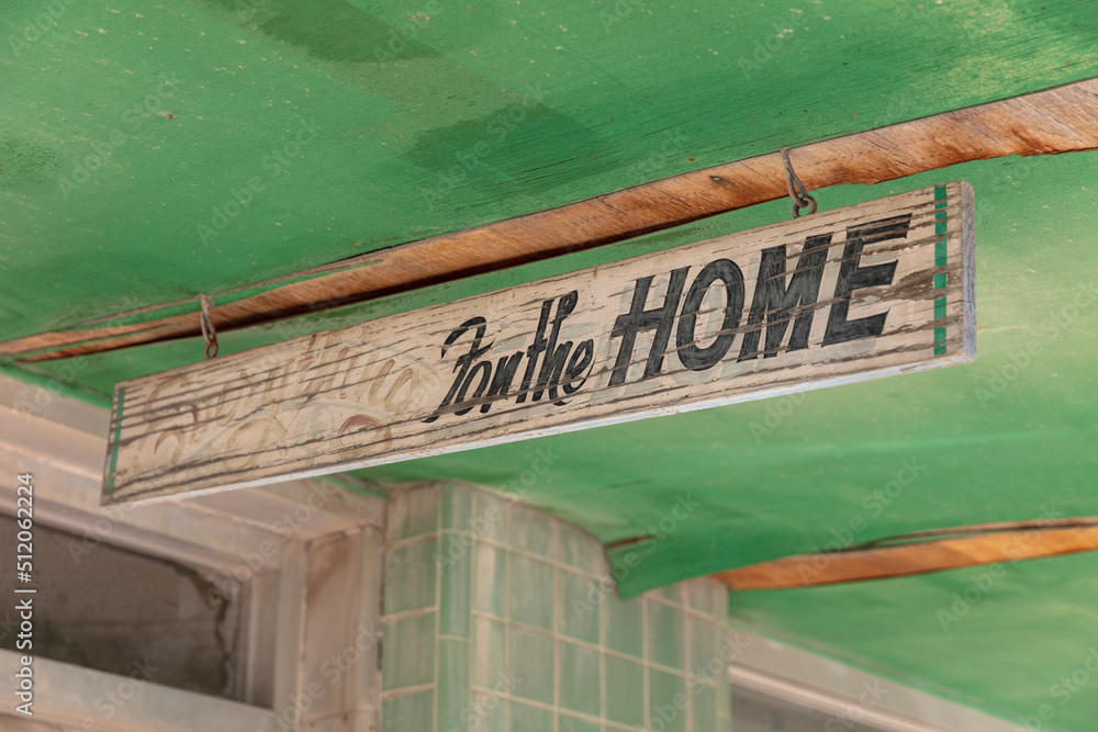 Old store sign on an abandoned building, For the Home, green roof and ...