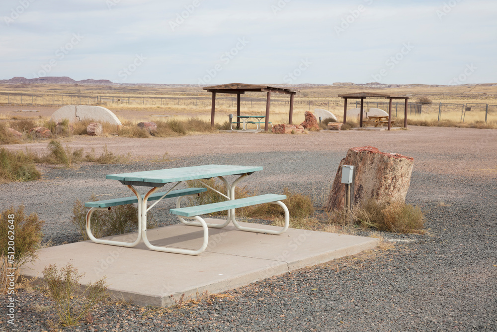 Roadside rest stop and picnic area, a bench in an arid desert landscape ...