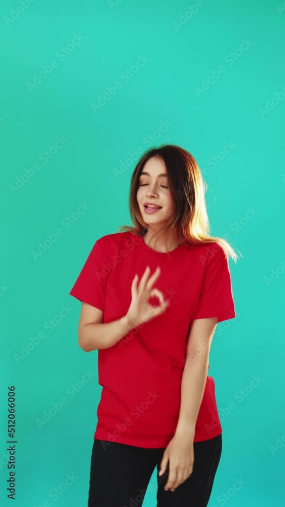 OK sign. Well done. Vertical portrait of satisfied cheerful woman in ...