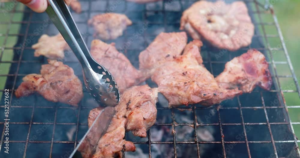Party raw pork marinated vinegar-pickled meat with spices being cooked ...