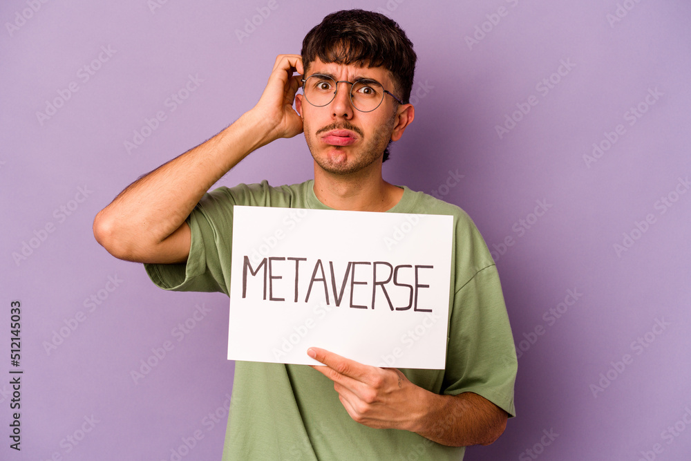 Young hispanic man holding meta verse placard isolated on purple ...