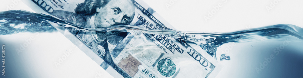 Money concept showing US Dollar sinking in water as a symbol of global ...