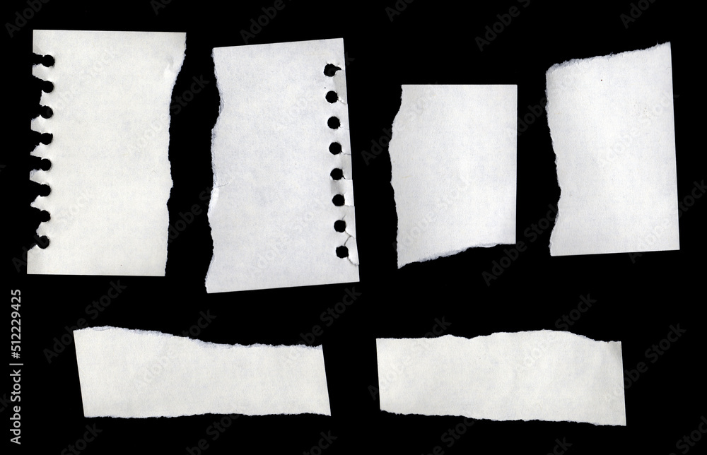 trozos de papel roto sobre ronfo negro Stock Photo | Adobe Stock