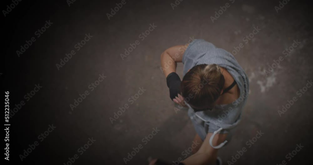Video Stock Cinematic shot of Professional female boxer practising ...