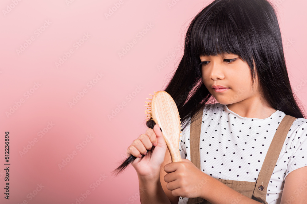 Child Brushing Hair