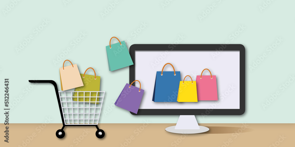 Desktop computer with shopping cart, colourful paper bags and box on ...