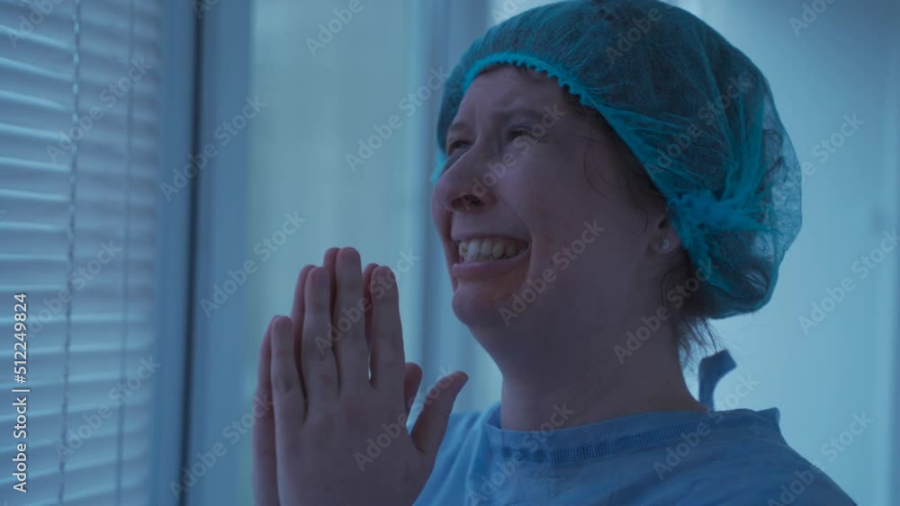 Nervous patient at hospital praying for good results. Woman after an ...