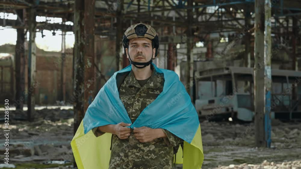Front view of fearless soldier in military uniform and helmet covered ...